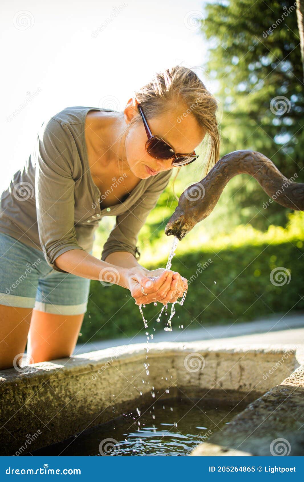 Woman Drinking from a Fountain Stock Image - Image of fitness ...