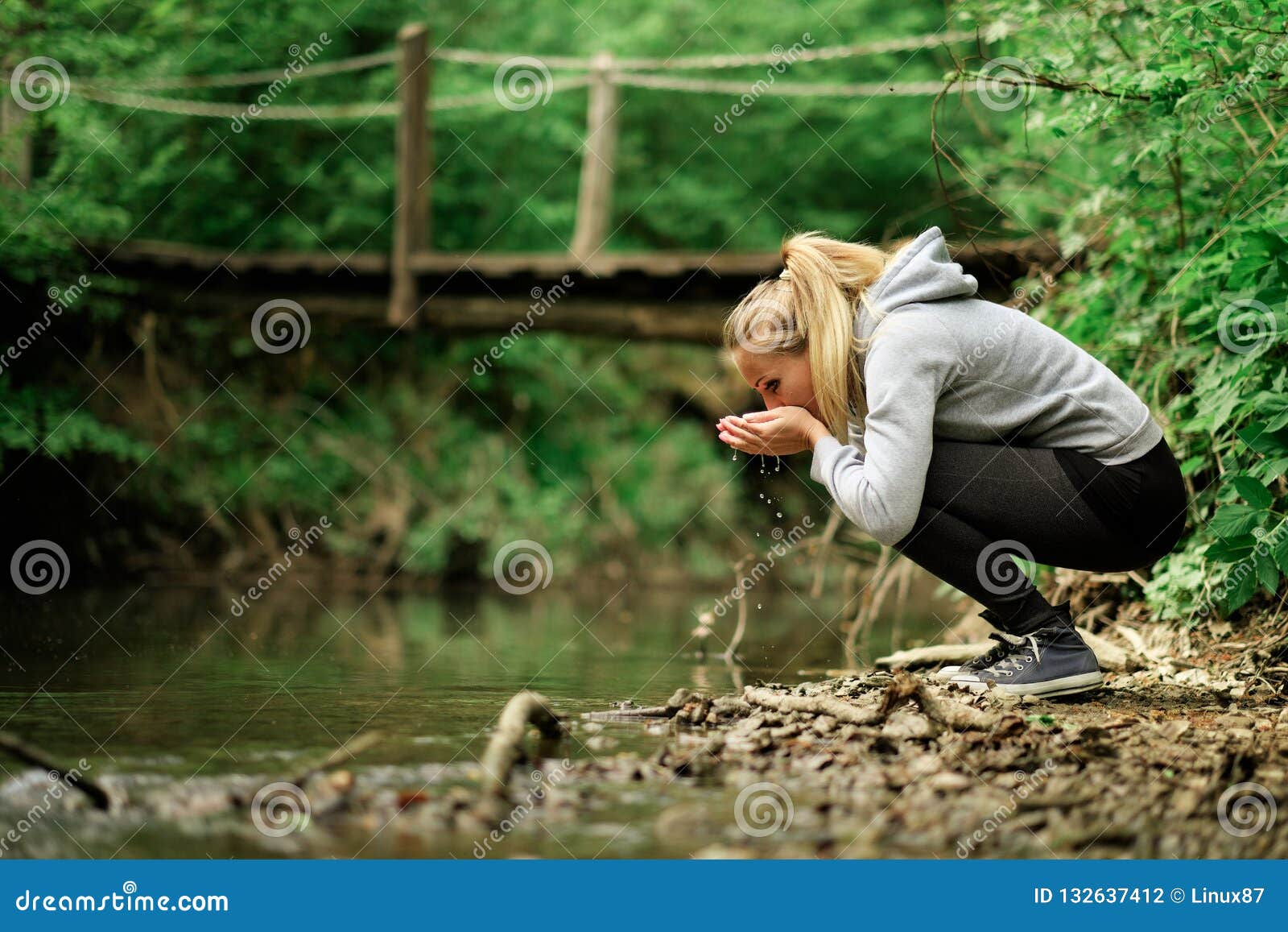 Woman Drinking a Fresh Water Stream Stock Photo - Image of creek, aqua ...