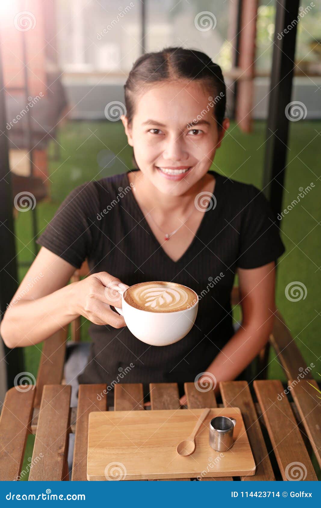 Woman Drinking Hot Coffee in the Morning, with Heart Shape Pattern on ...