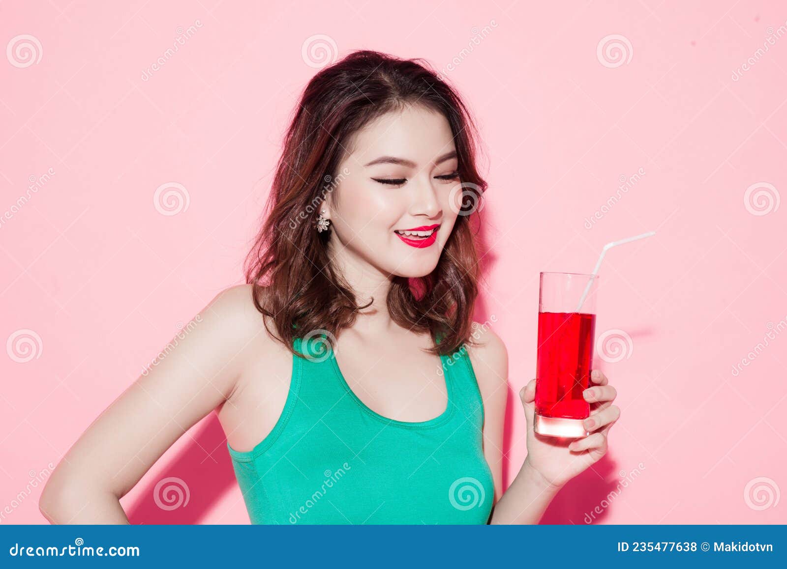 Woman Drinking Red Juice Over Pink Stock Photo - Image of cocktail ...