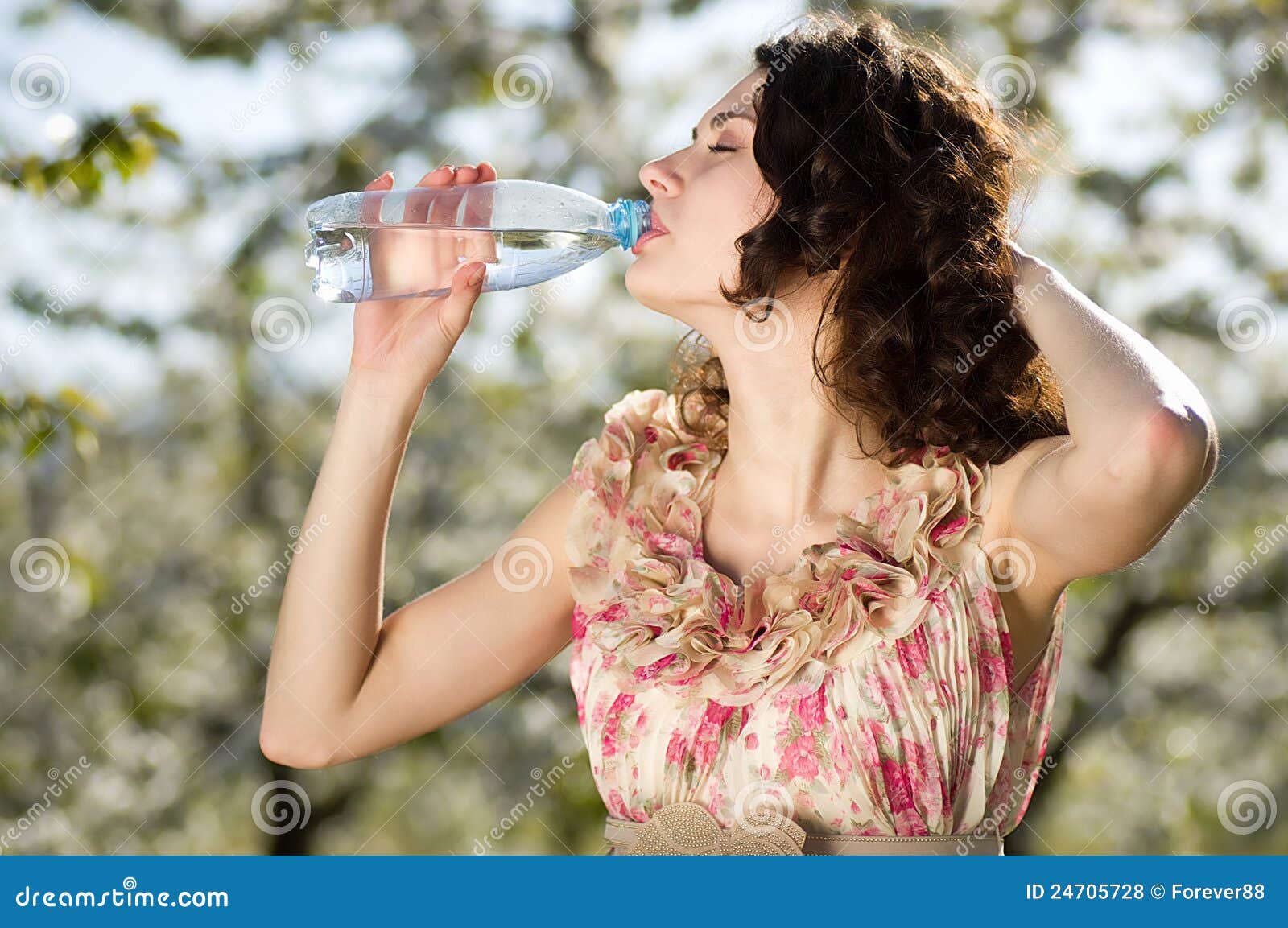 Woman Drinks Cold Water in Spring Garden Stock Photo - Image of person ...