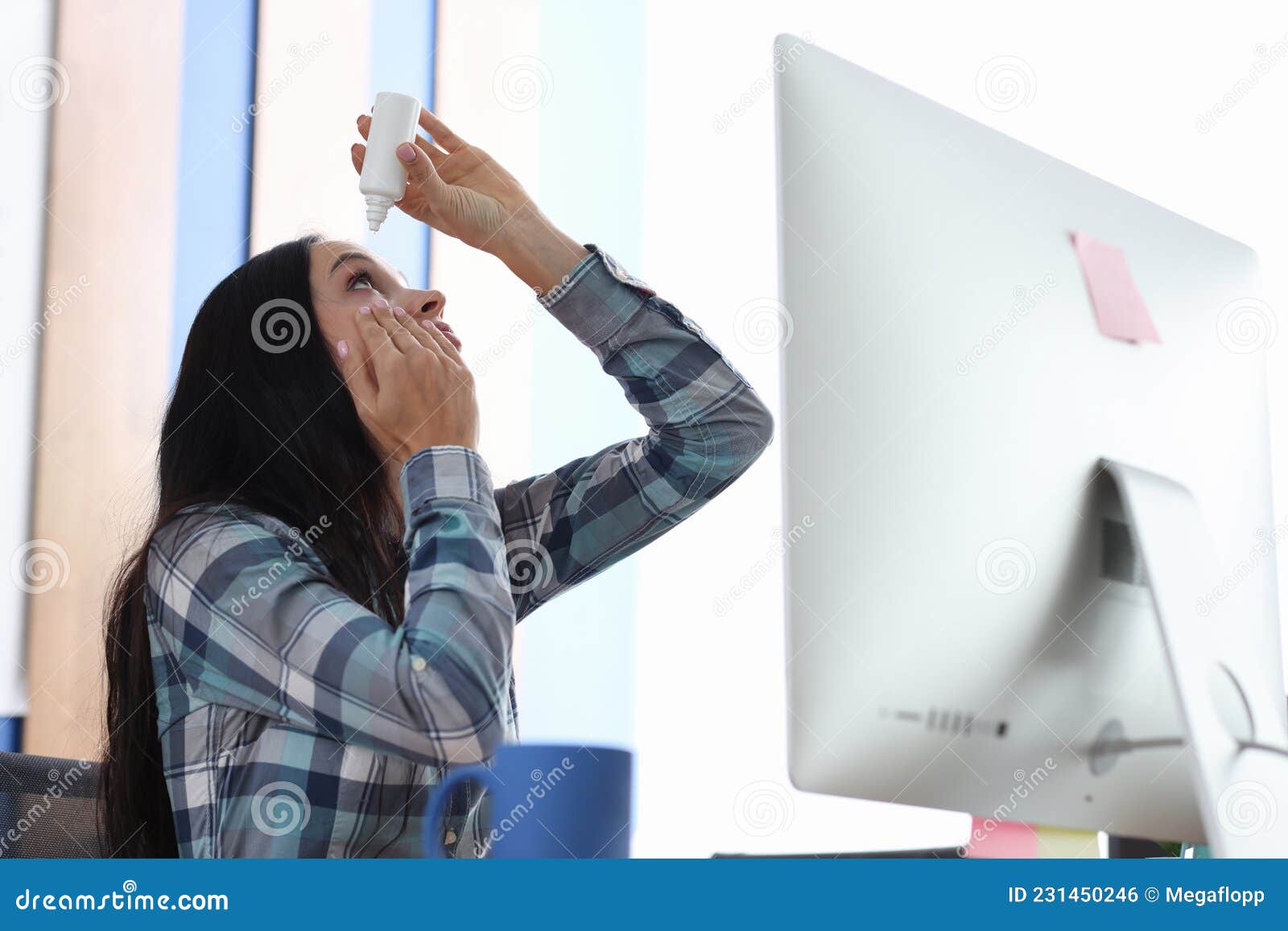 Woman Drips Eye Drops into Eyes while Sitting at Workplace at Computer ...