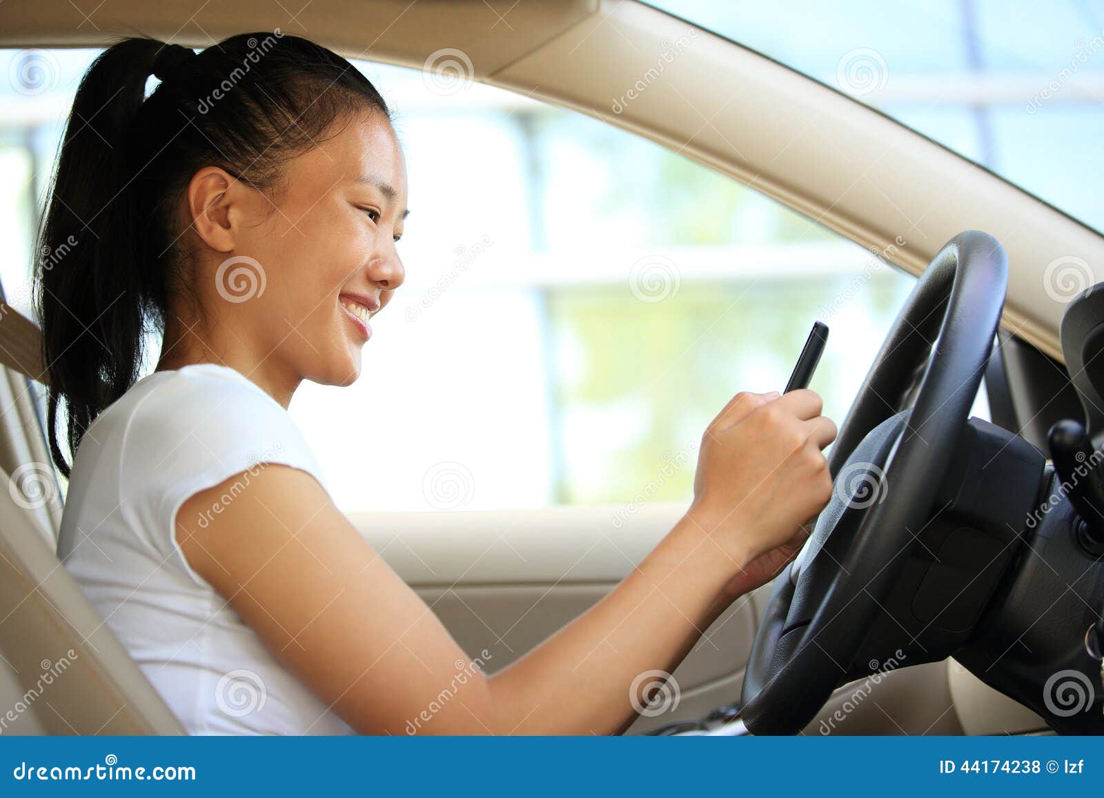 Woman Driver Use Cell Phone in Car Stock Photo - Image of hair, hold ...