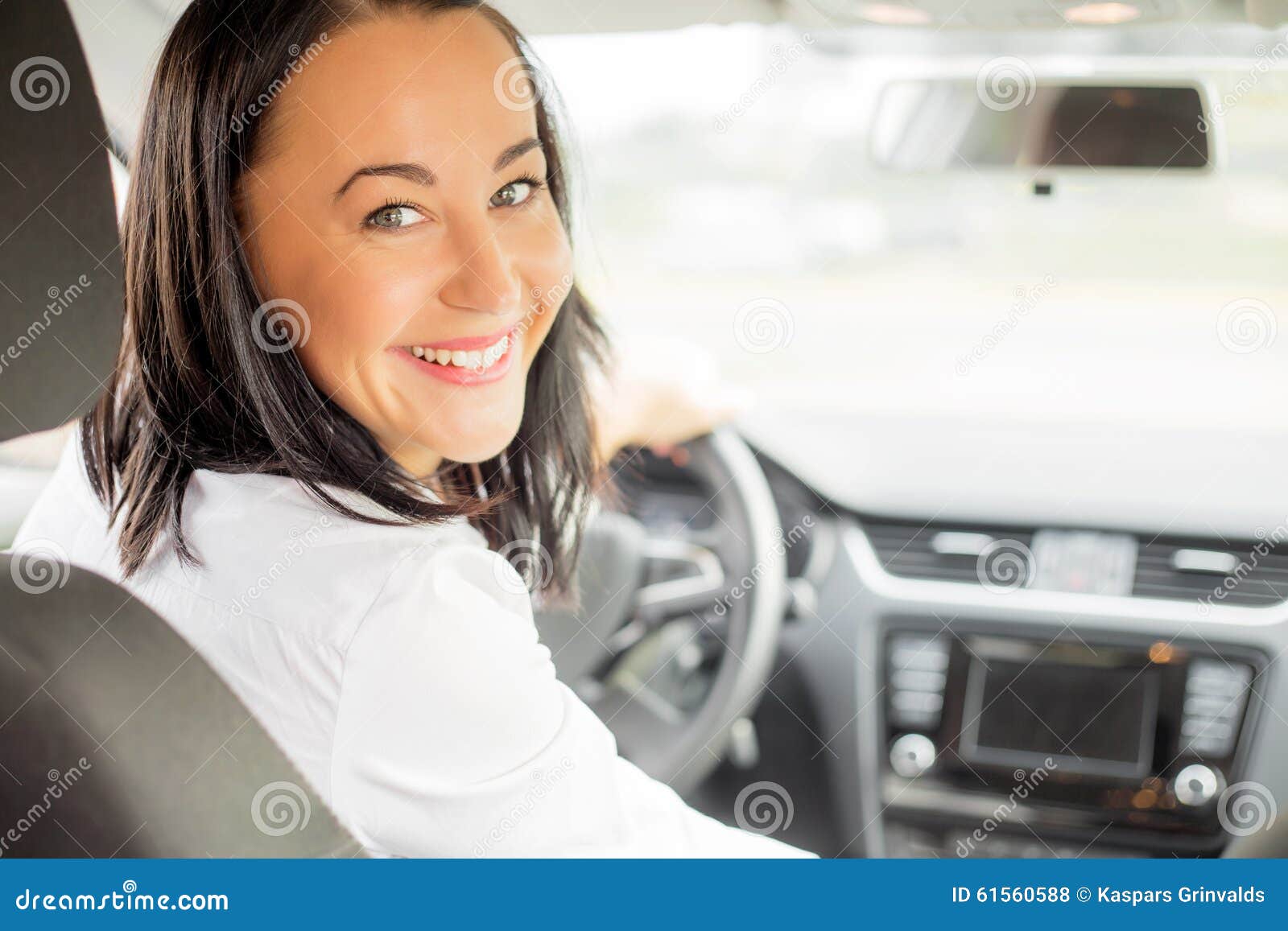 Woman In Drivers Seat Smiling Stock Photo | CartoonDealer.com #61560588
