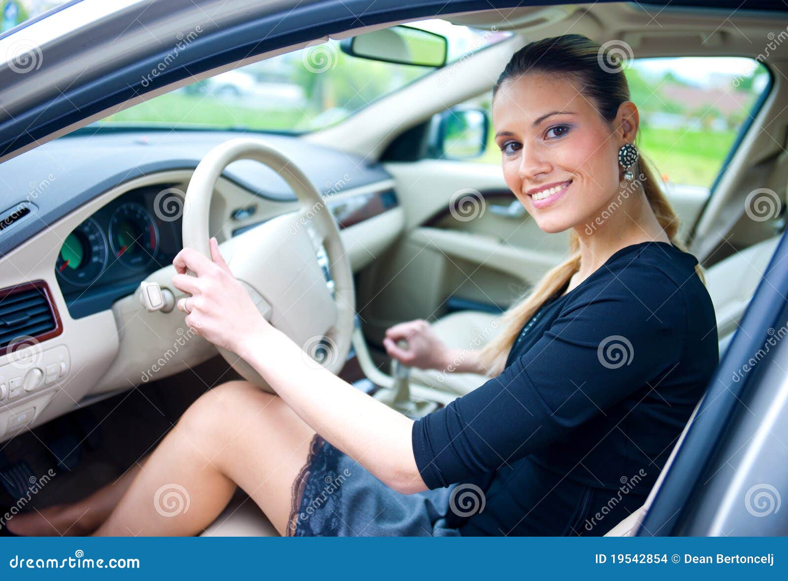 Woman driving car stock photo. Image of elegance, smile - 19542854