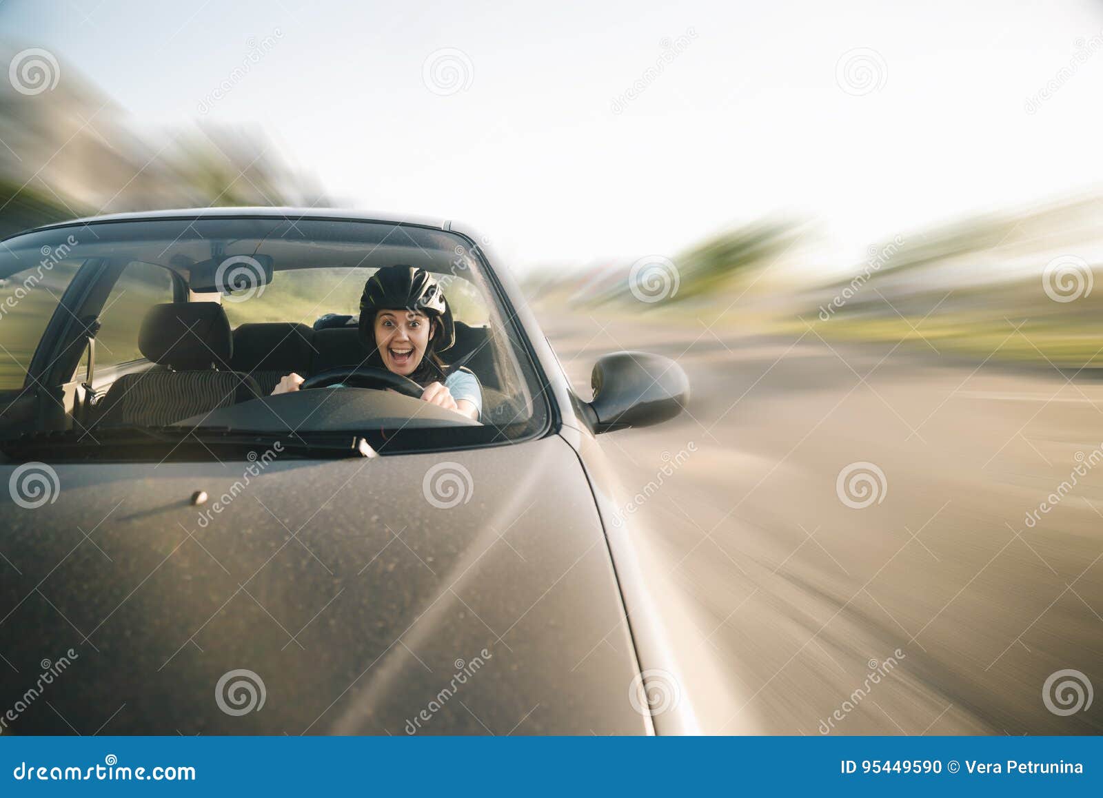 Woman Driving Car in Helmet with Horror on Her Face Stock Photo - Image ...