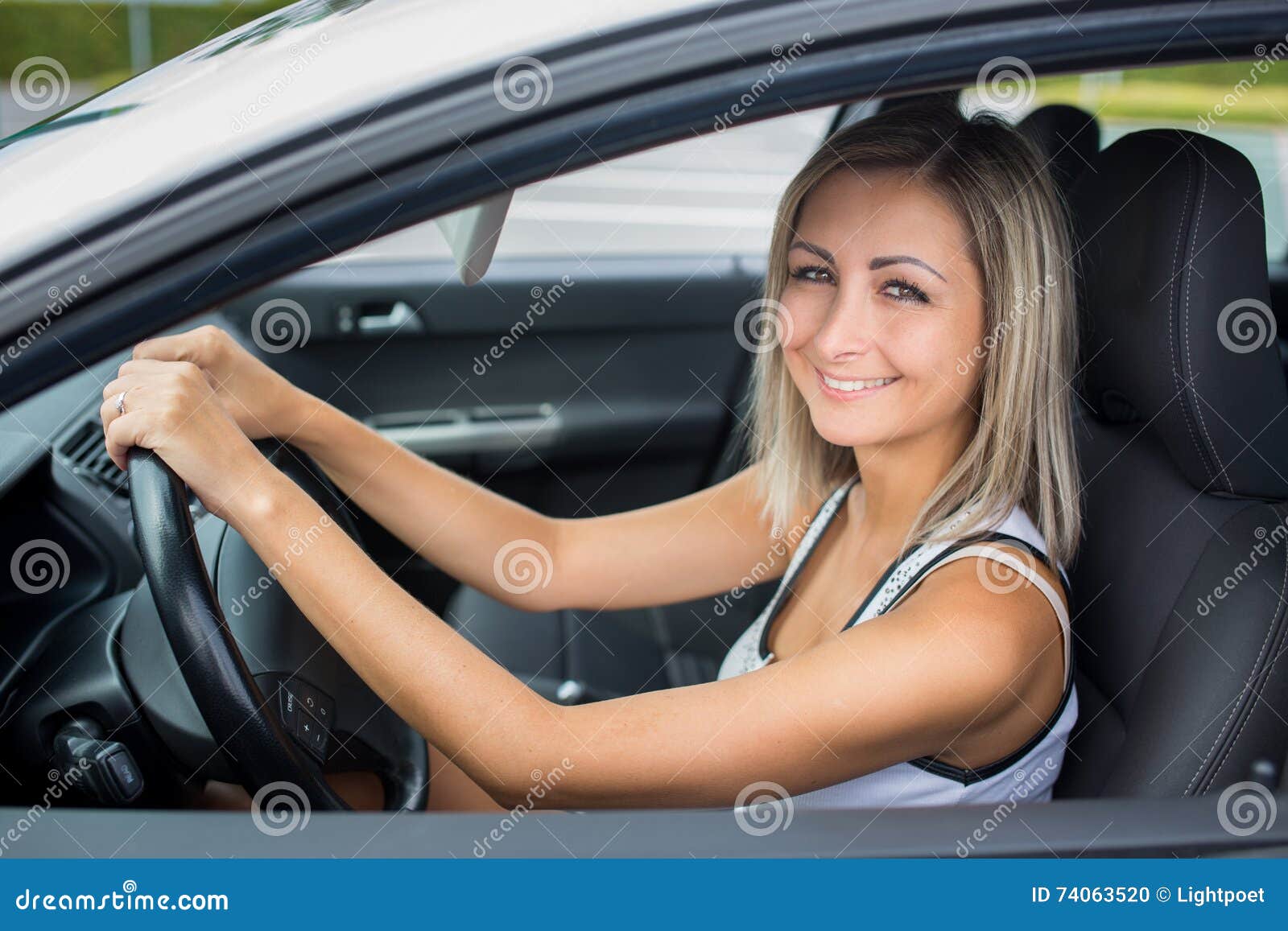 Woman driving a car stock photo. Image of person, seat - 74063520
