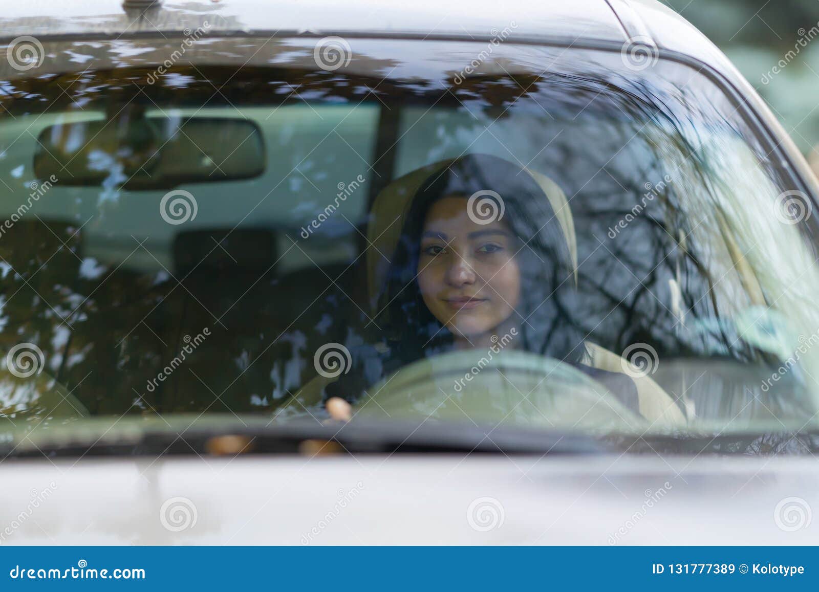 Woman Driving a Car Viewed through the Windscreen. Stock Image - Image ...
