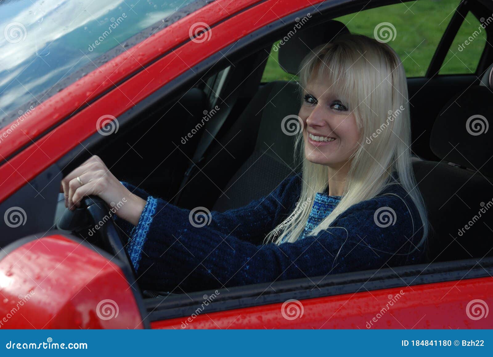 Woman driving a red car stock photo. Image of inside - 184841180