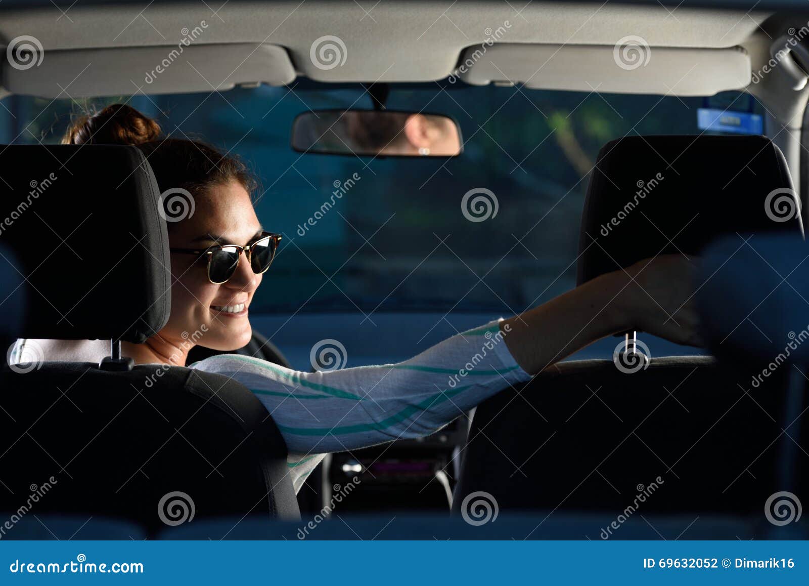 Woman driving on reverse stock photo. Image of wheel - 69632052