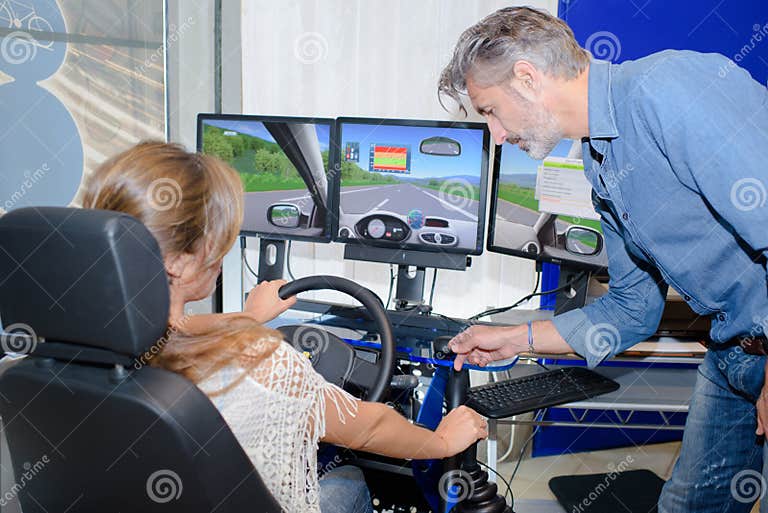 Woman in driving simulator stock photo. Image of simulator - 227973166