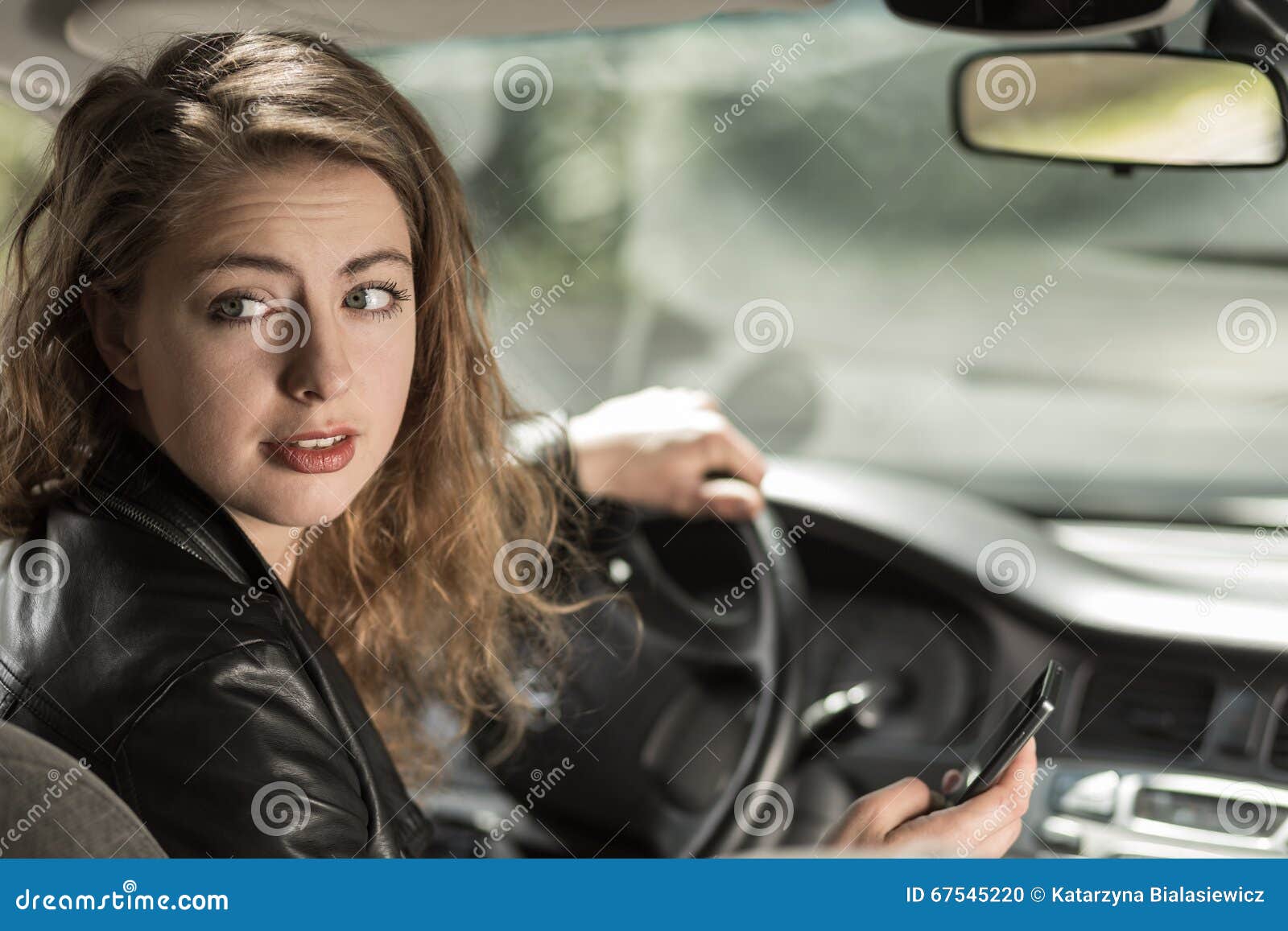 Woman driving and texting stock photo. Image of drive - 67545220