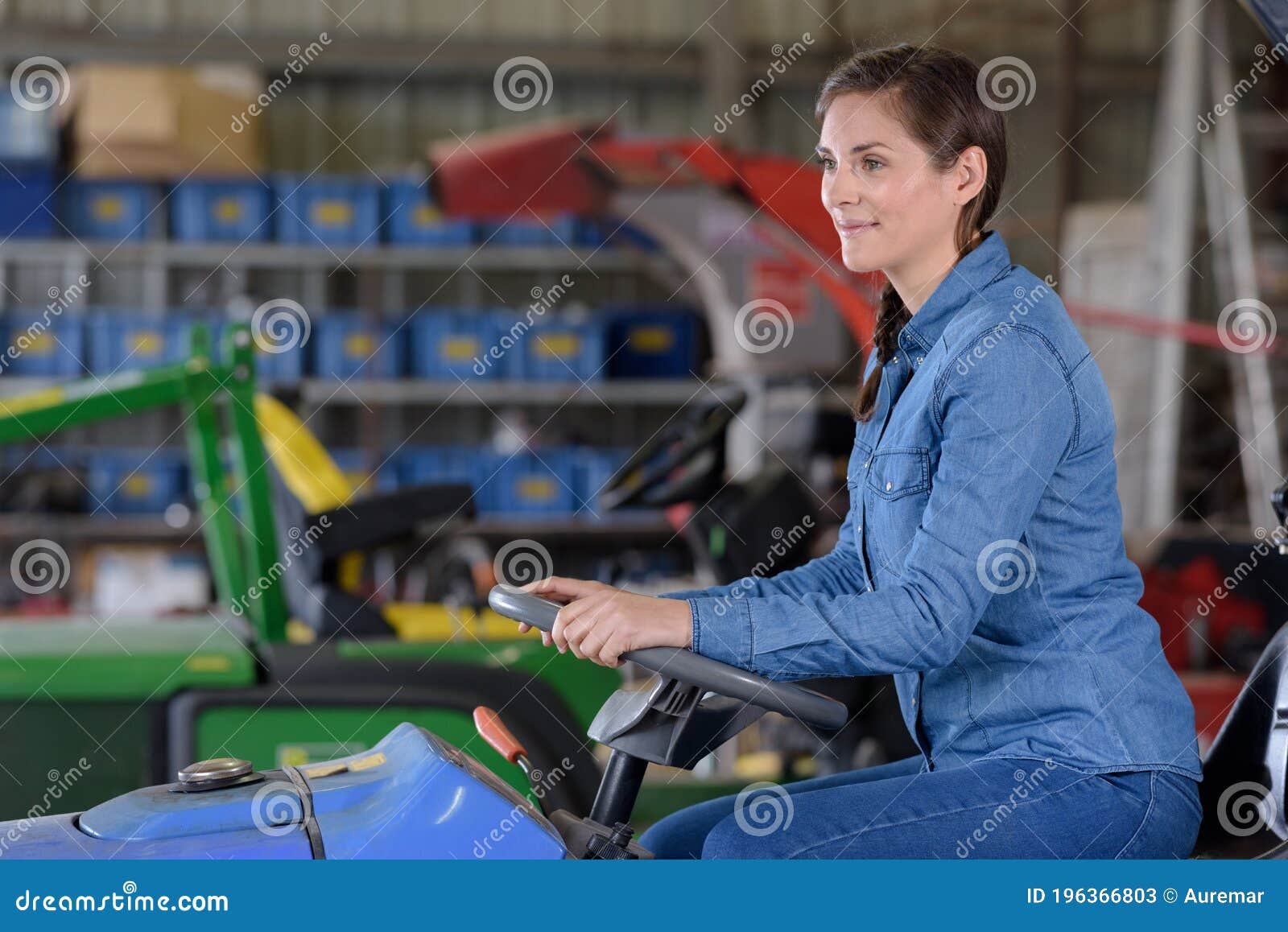 Woman driving tractor stock image. Image of countryside - 196366803