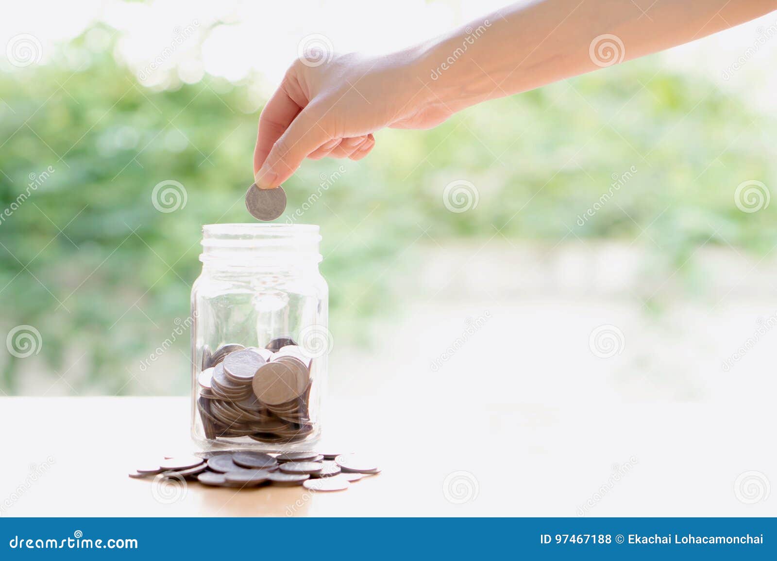 Woman Dropping Coins into a Glass Jar Stock Photo - Image of ideas ...