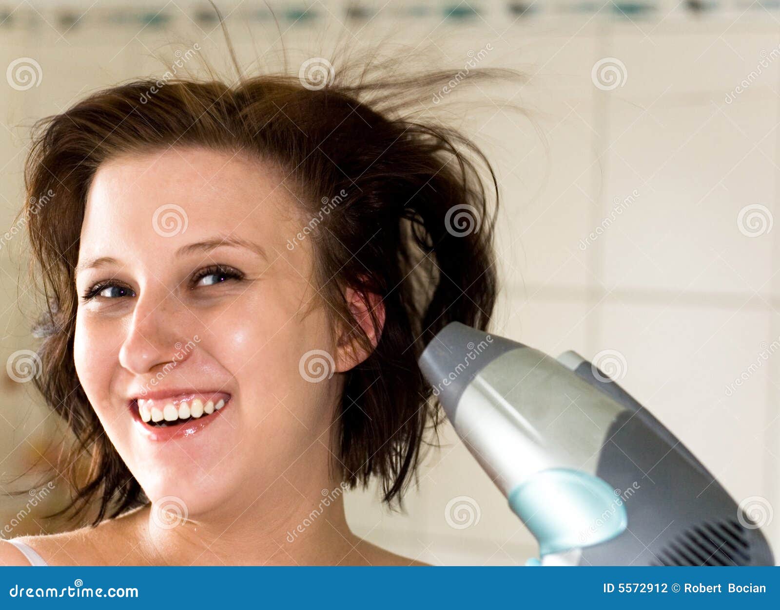 Woman with dryer stock photo. Image of hairdryer, brunette - 5572912