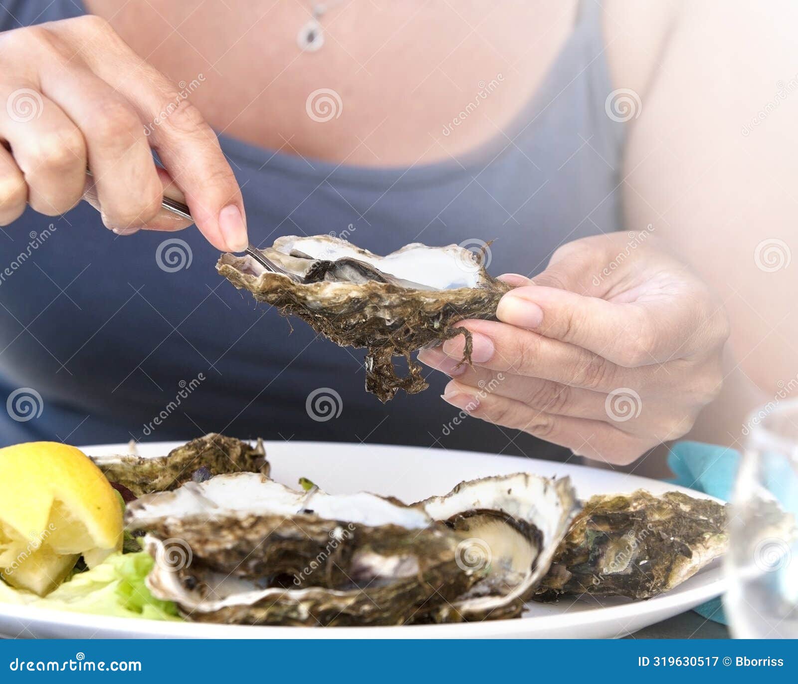 Woman Eat Oysters with Lemon. Soft Sunlight Stock Image - Image of ...