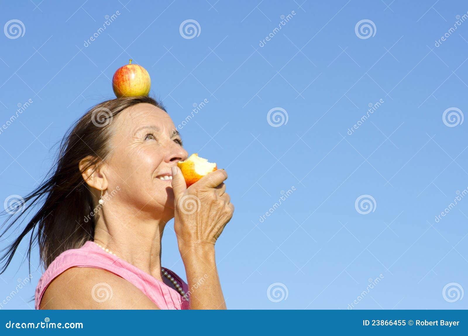 Woman eating an apple VI stock image. Image of beautiful - 23866455