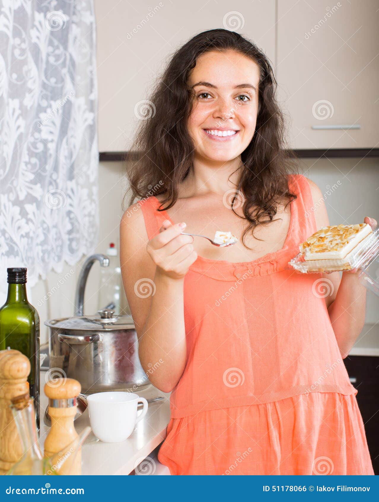 Woman Eating Biscuit in Kitchen Stock Photo - Image of rest, pastries ...