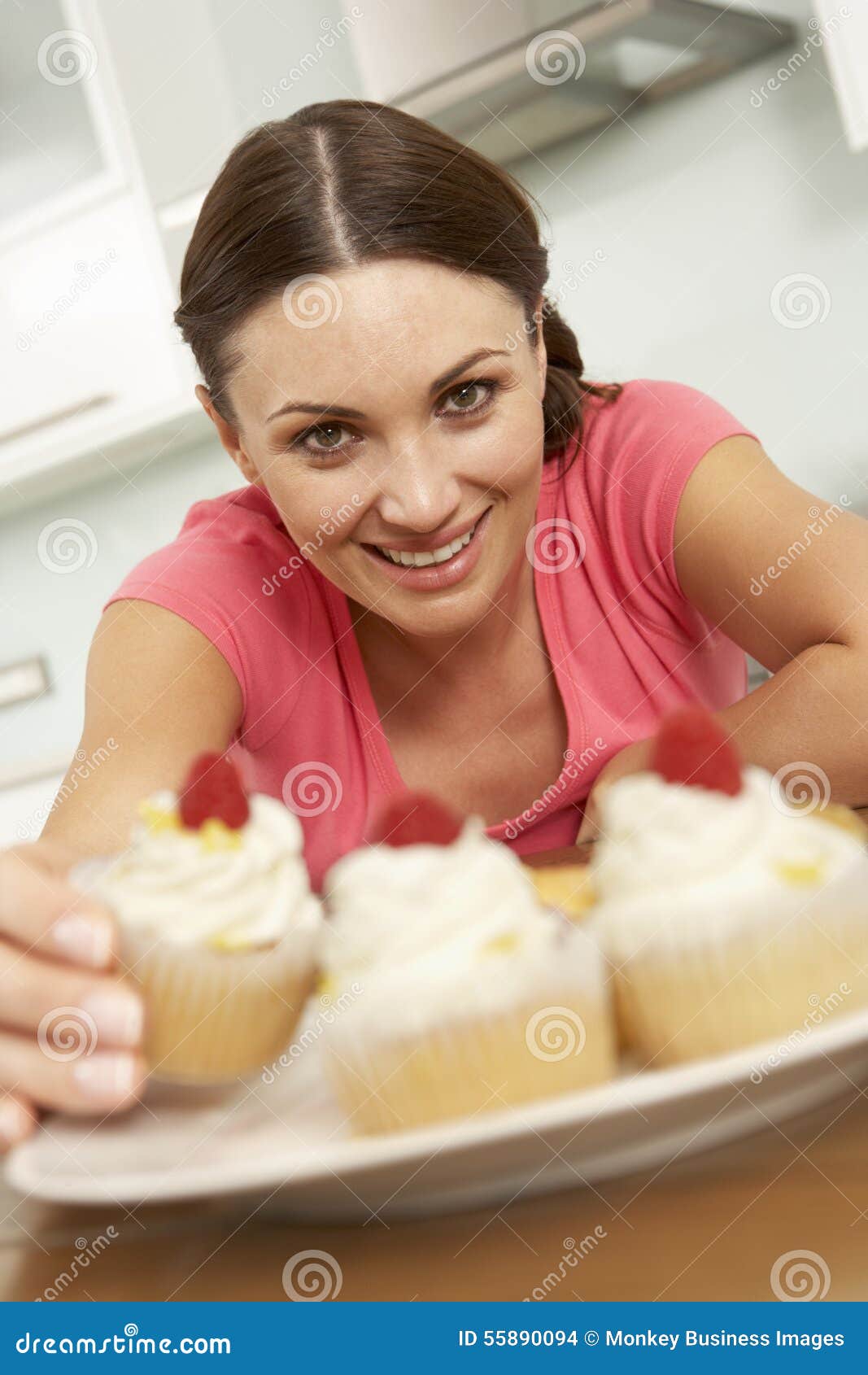 Woman Eating Cakes in Kitchen Stock Photo - Image of vertical ...