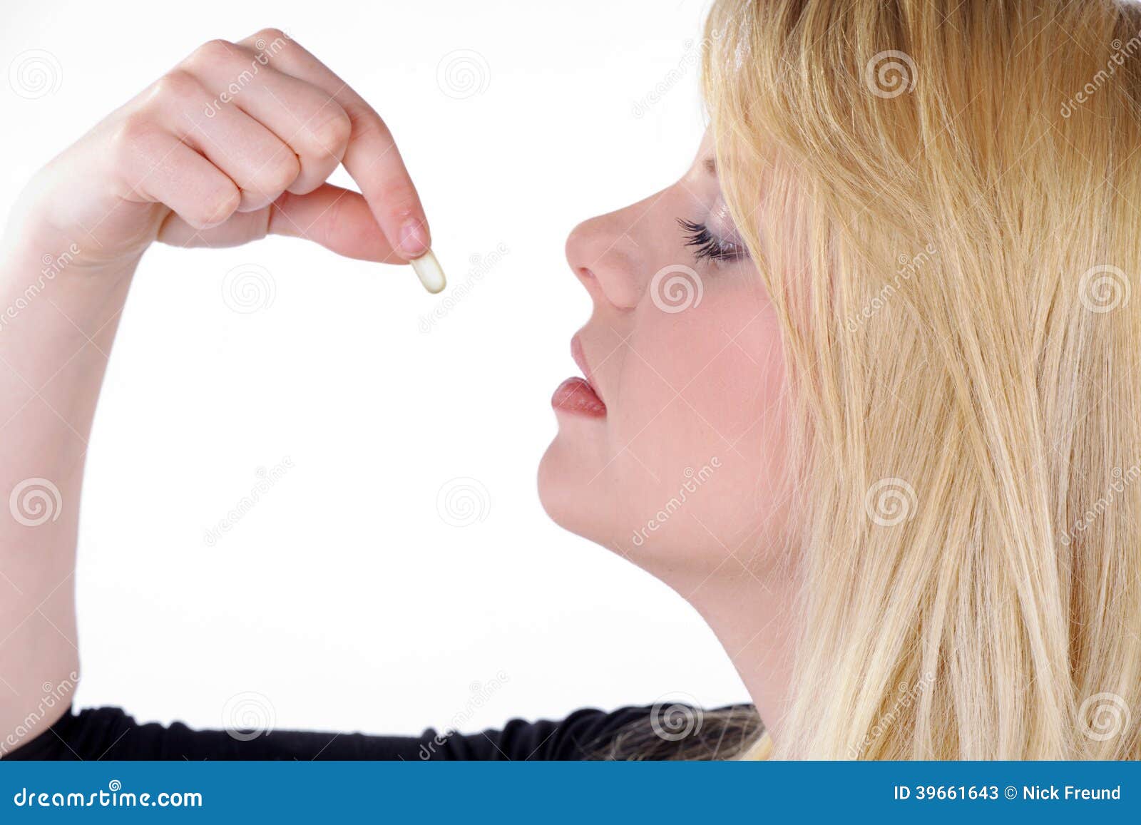Woman eating a capsule stock image. Image of caucasian - 39661643