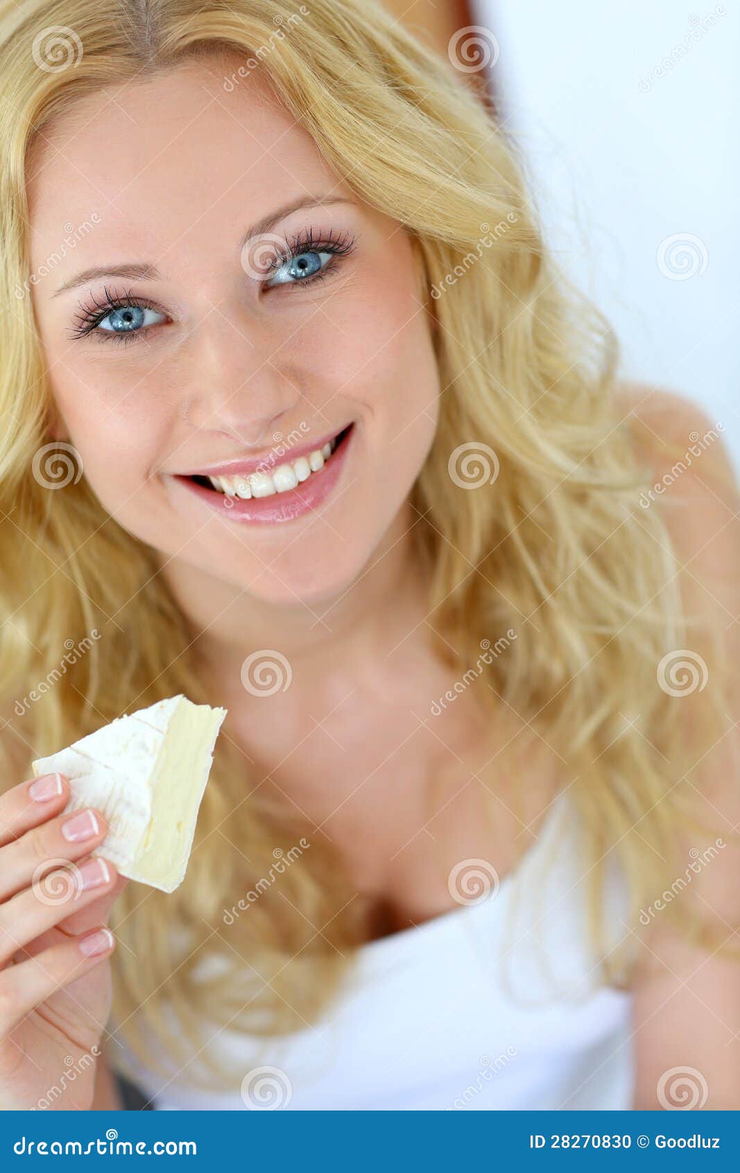 Woman eating cheese stock photo. Image of attractive - 28270830