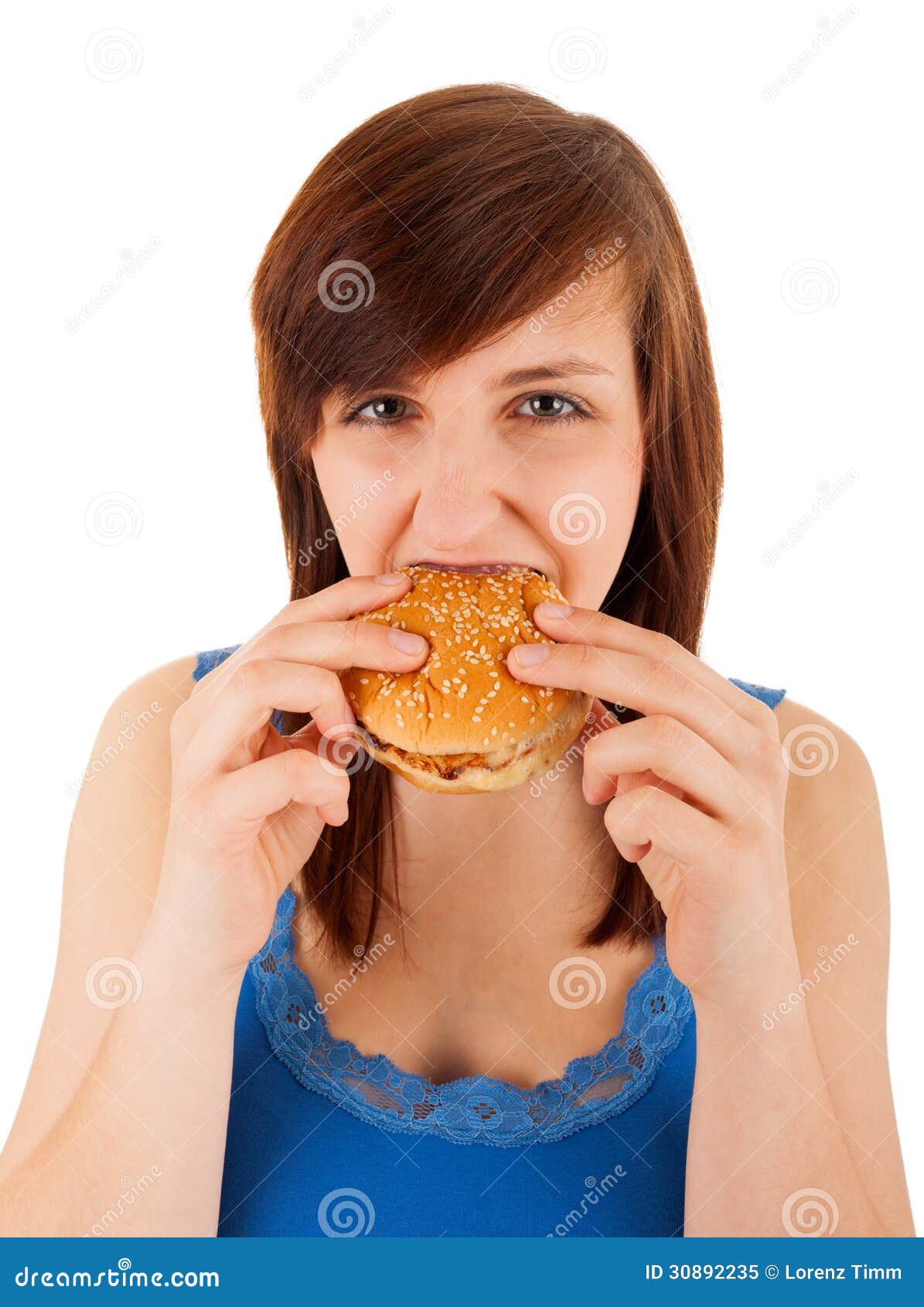 The Woman is Eating a Cheeseburger Stock Image - Image of optional ...