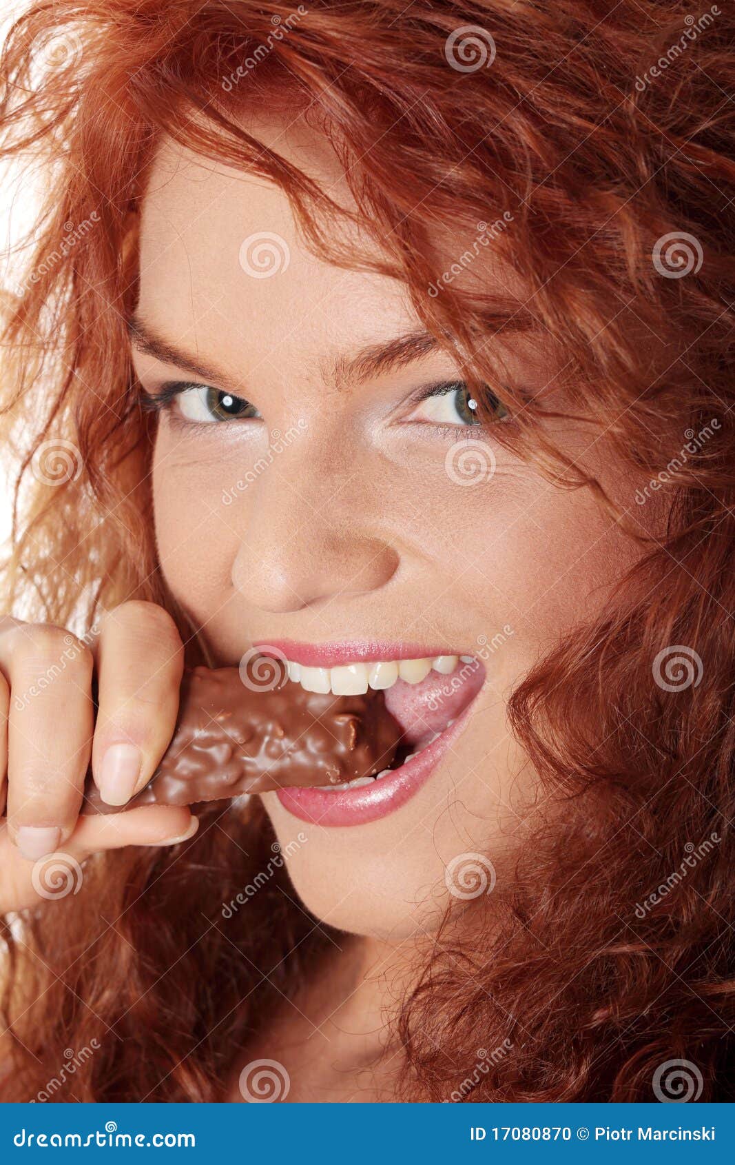 Woman eating chocolate bar stock photo. Image of hand - 17080870