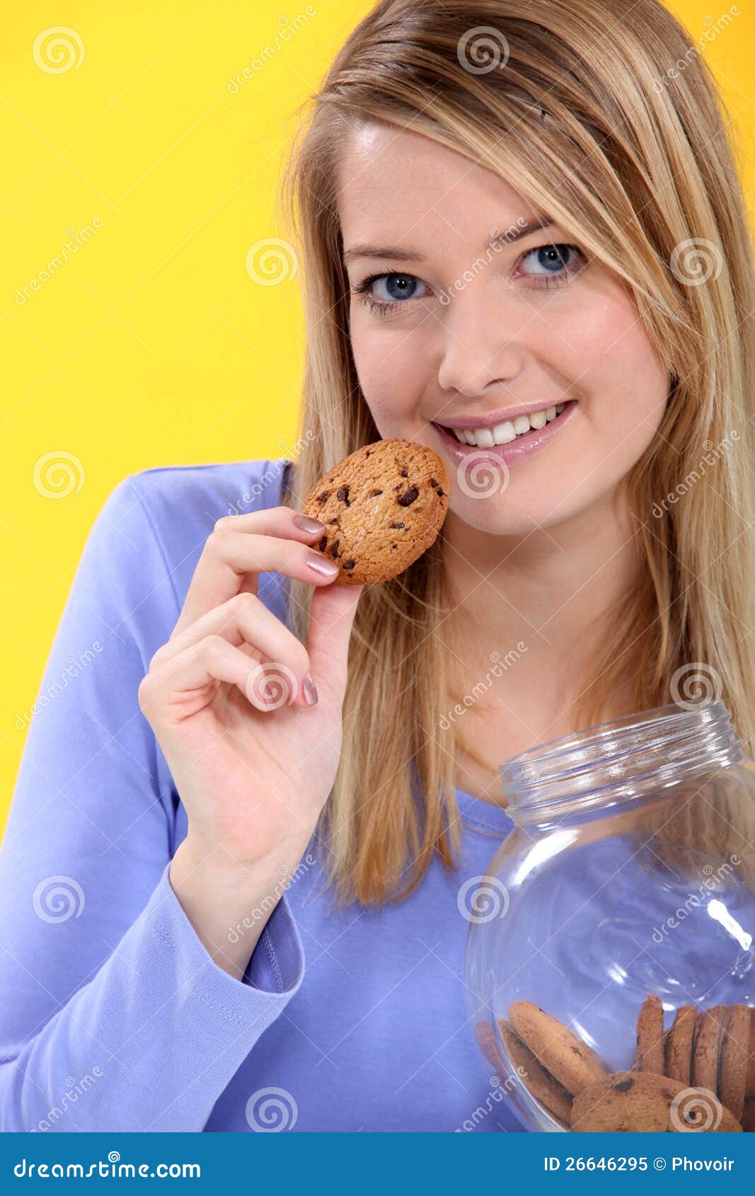 Woman eating a cookie stock image. Image of gluttony - 26646295