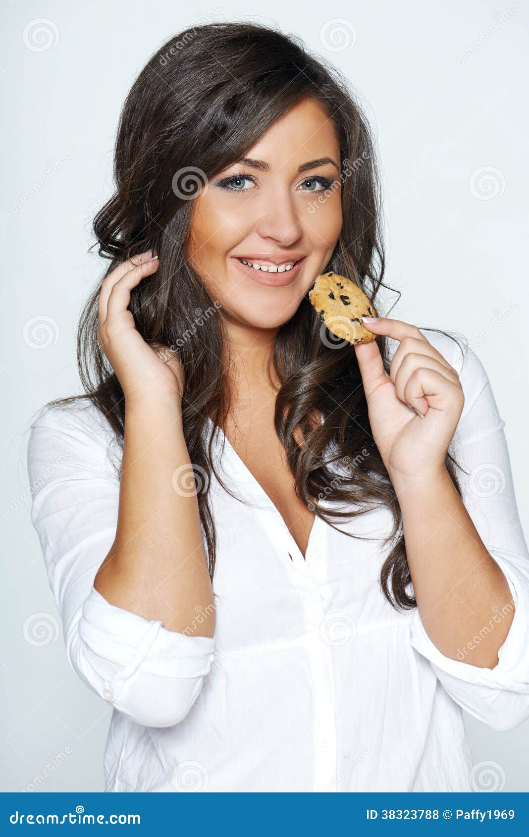 Woman eating cookie stock photo. Image of pastry, snack - 38323788
