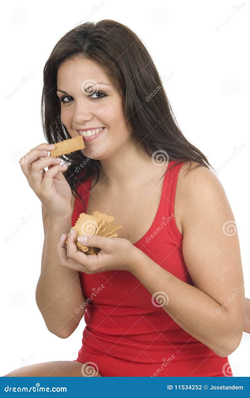 Woman eating cookies stock photo. Image of beautiful - 11534252