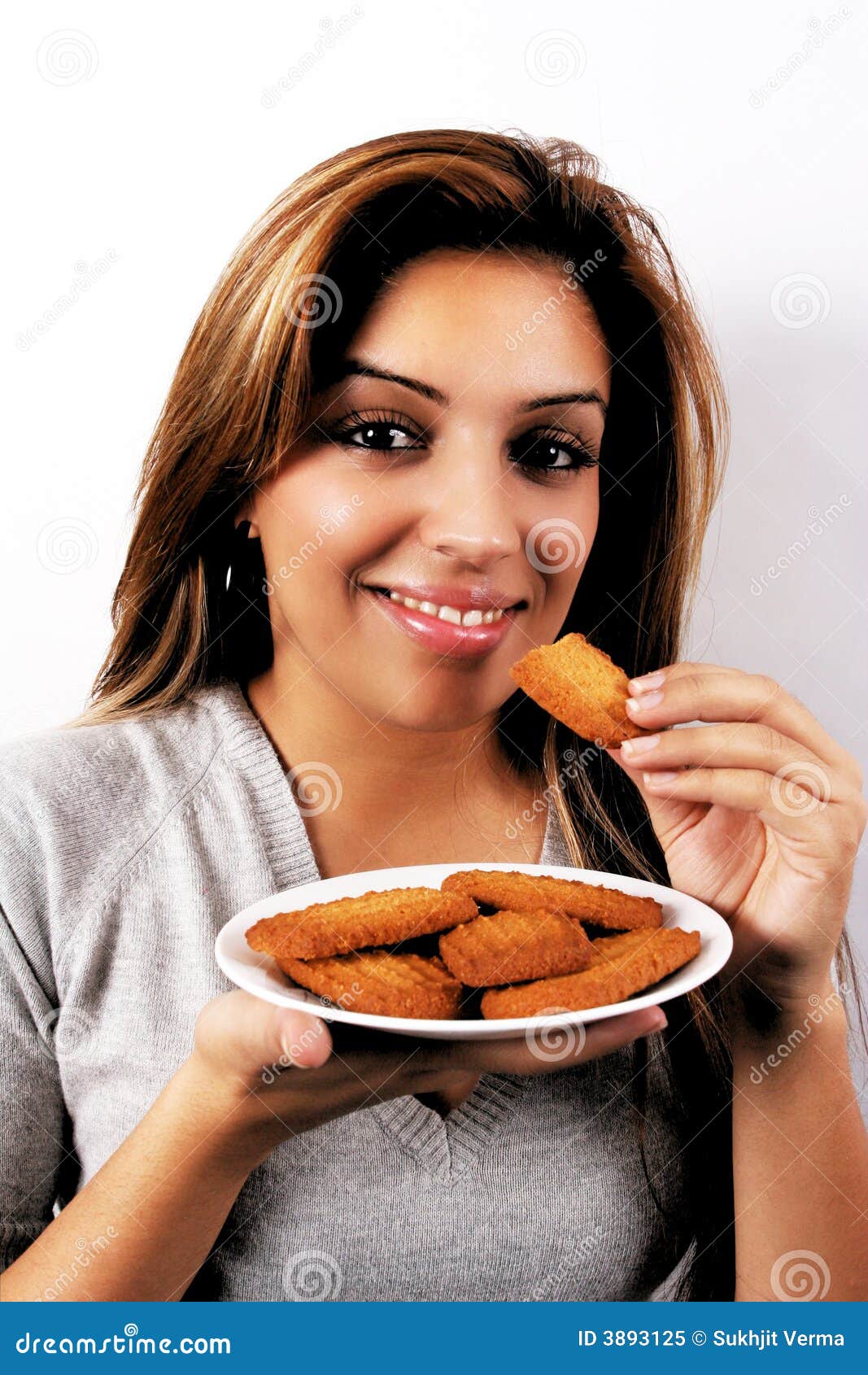Woman eating cookies stock image. Image of eyes, eats - 3893125