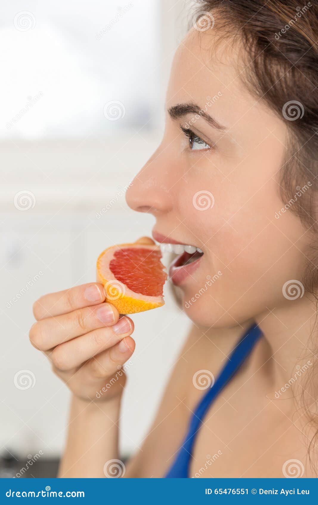 Woman eating fresh fruit stock image. Image of woman - 65476551
