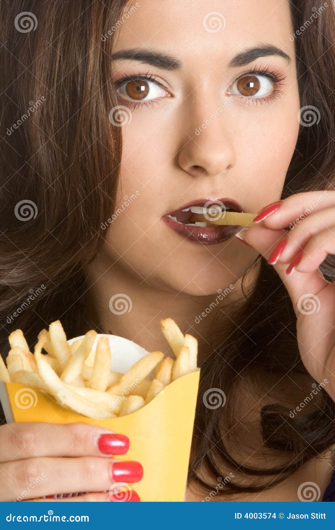 Woman Eating Fries stock photo. Image of mouth, dinner - 4003574