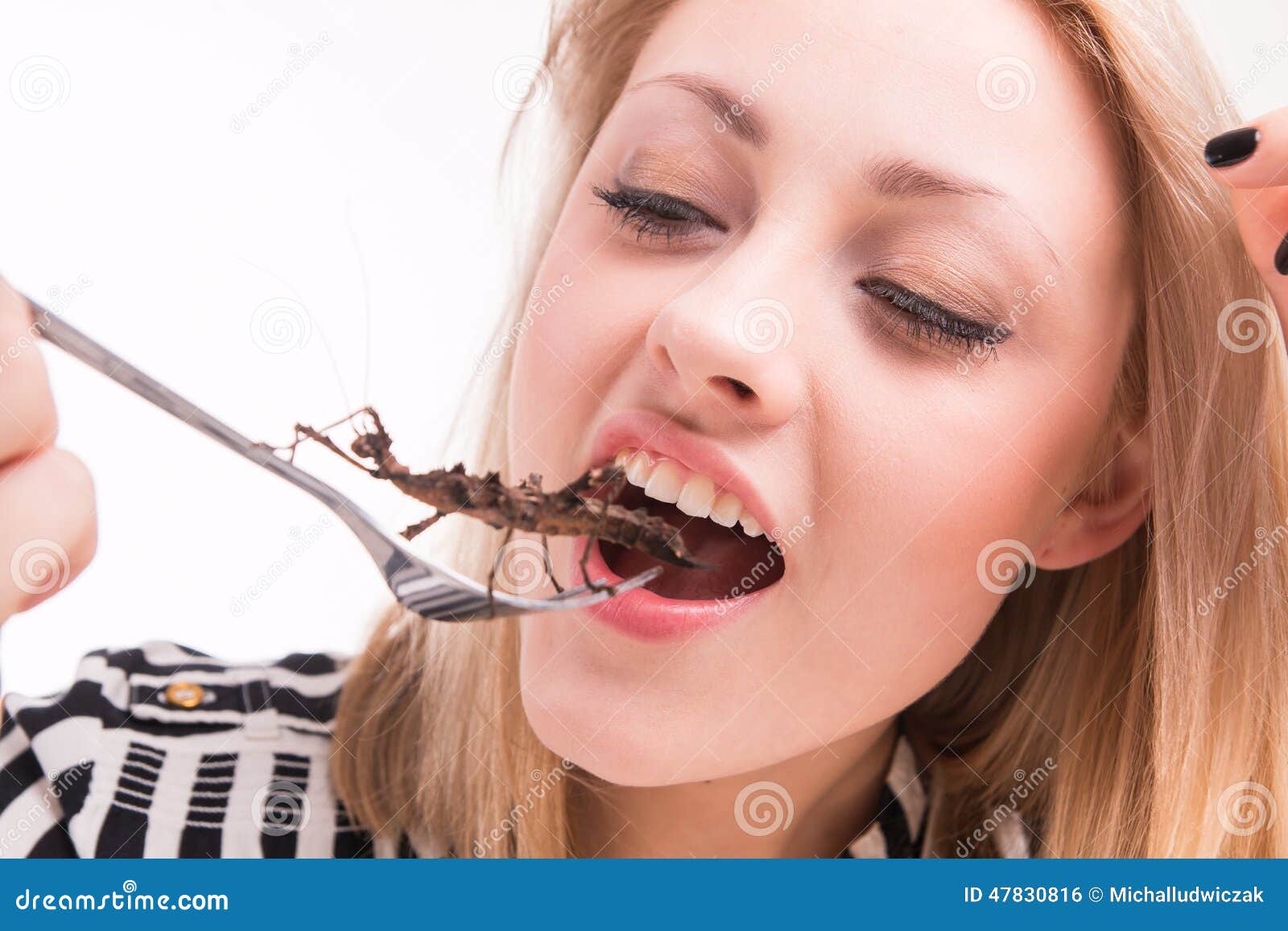Woman Eating Insects with a Fork in a Restaurant Stock Photo - Image of ...