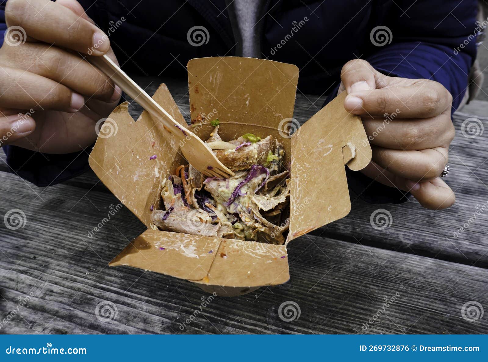A woman eating kebab stock photo. Image of grilled, chicken - 269732876