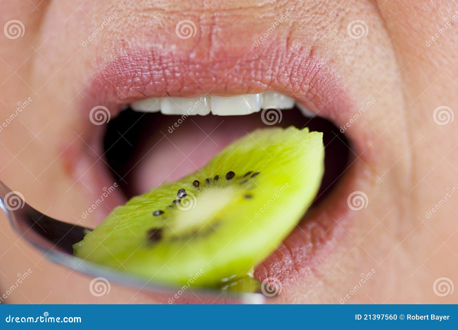 Woman Eating Kiwi Fruit stock photo. Image of eating - 21397560