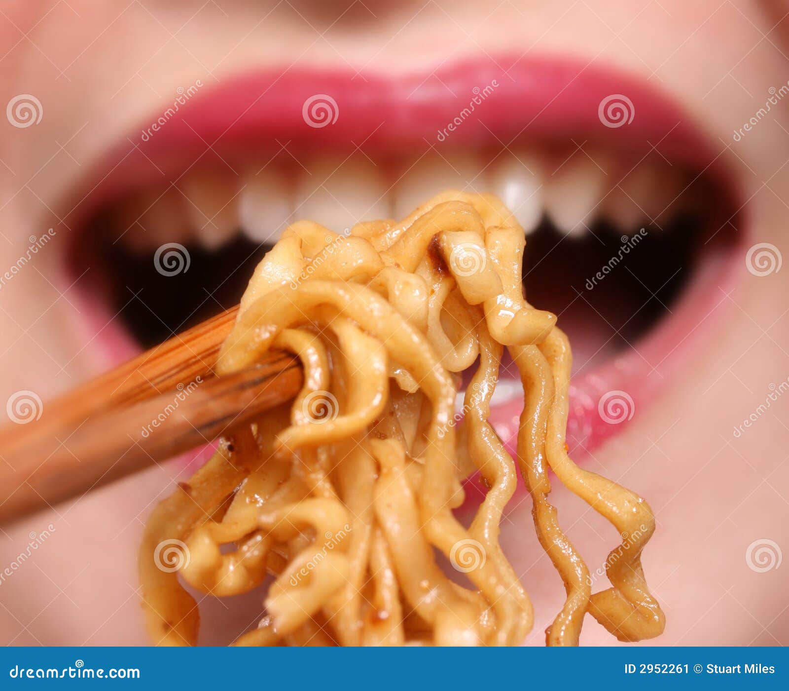 Woman eating noodles stock image. Image of food, shiny - 2952261