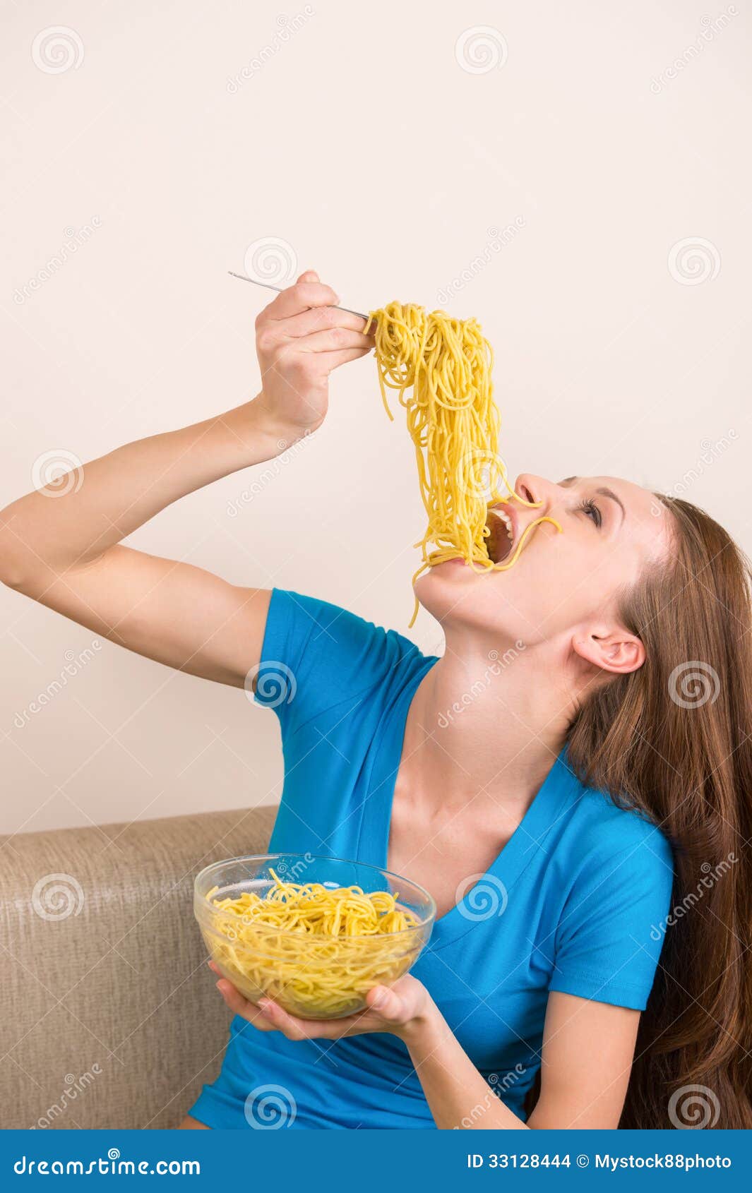 Woman eating noodles. stock photo. Image of beautiful - 33128444