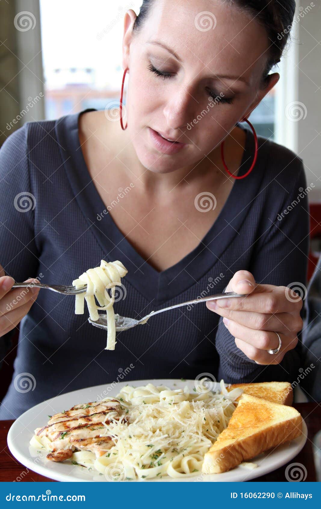 Woman Eating Pasta stock photo. Image of dinner, meal - 16062290