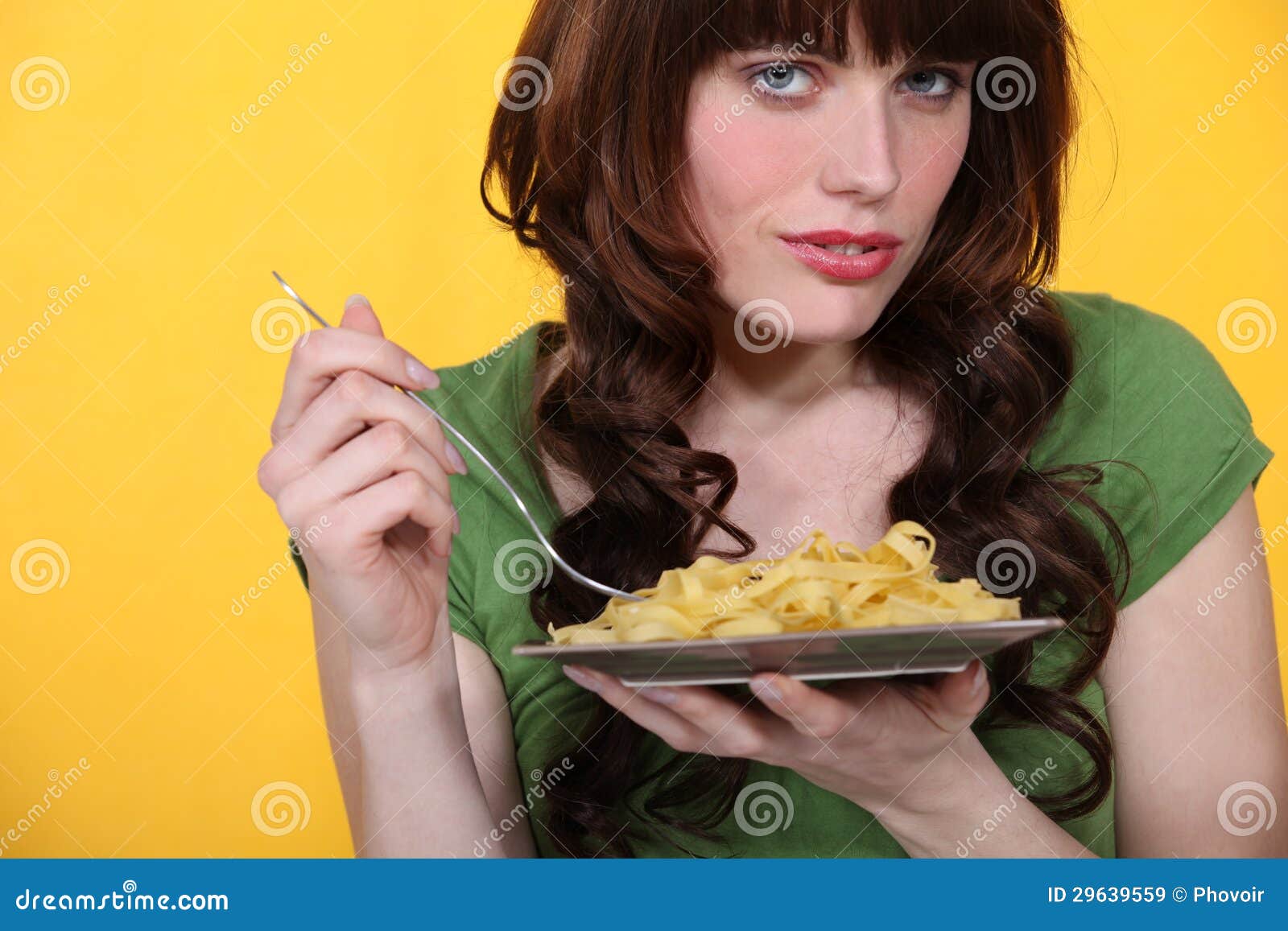 A woman eating pasta stock image. Image of adult, famished - 29639559