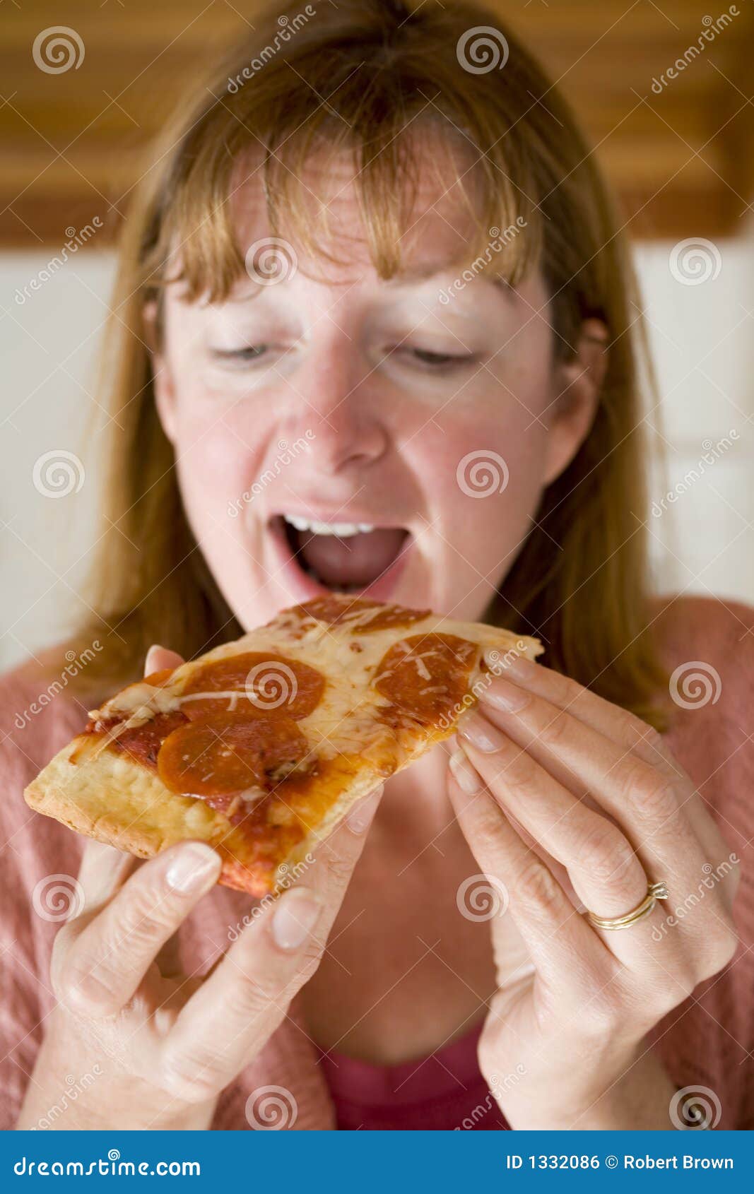 Woman Eating Pepperoni Pizza Stock Photo - Image of cheese, food: 1332086
