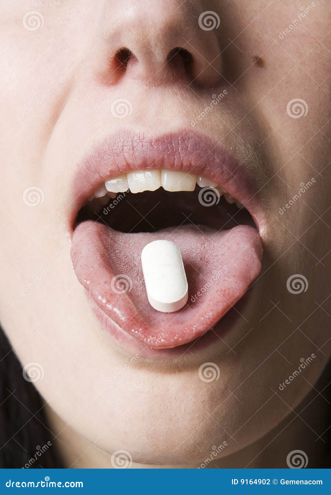 Woman eating pill stock photo. Image of addiction, pills - 9164902