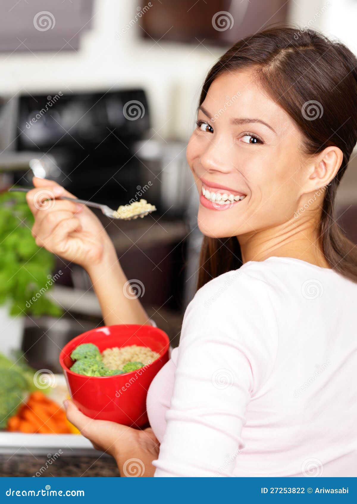 Woman eating quinoa salad stock photo. Image of chinese - 27253822