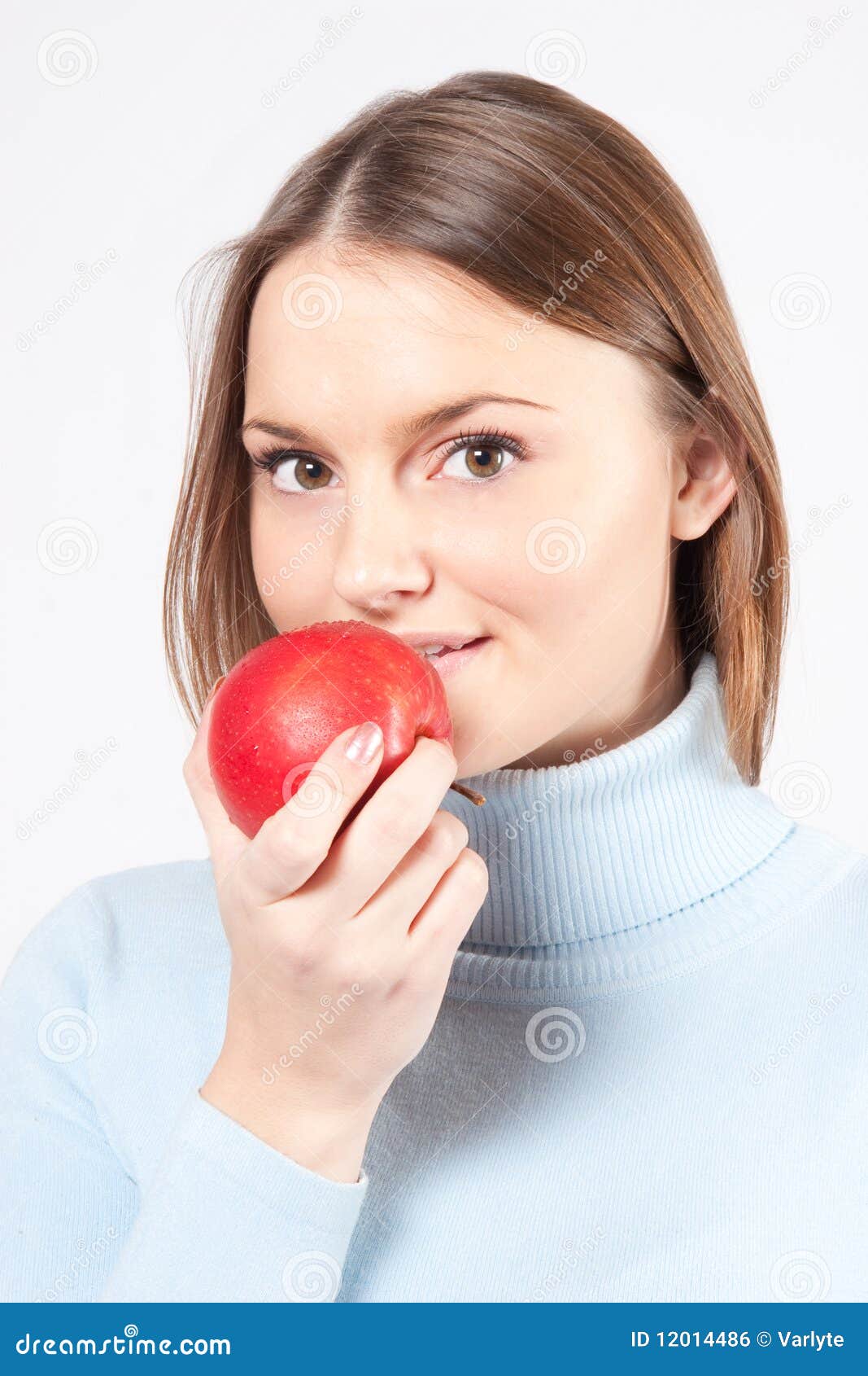 Woman eating red apple stock photo. Image of beautiful - 12014486