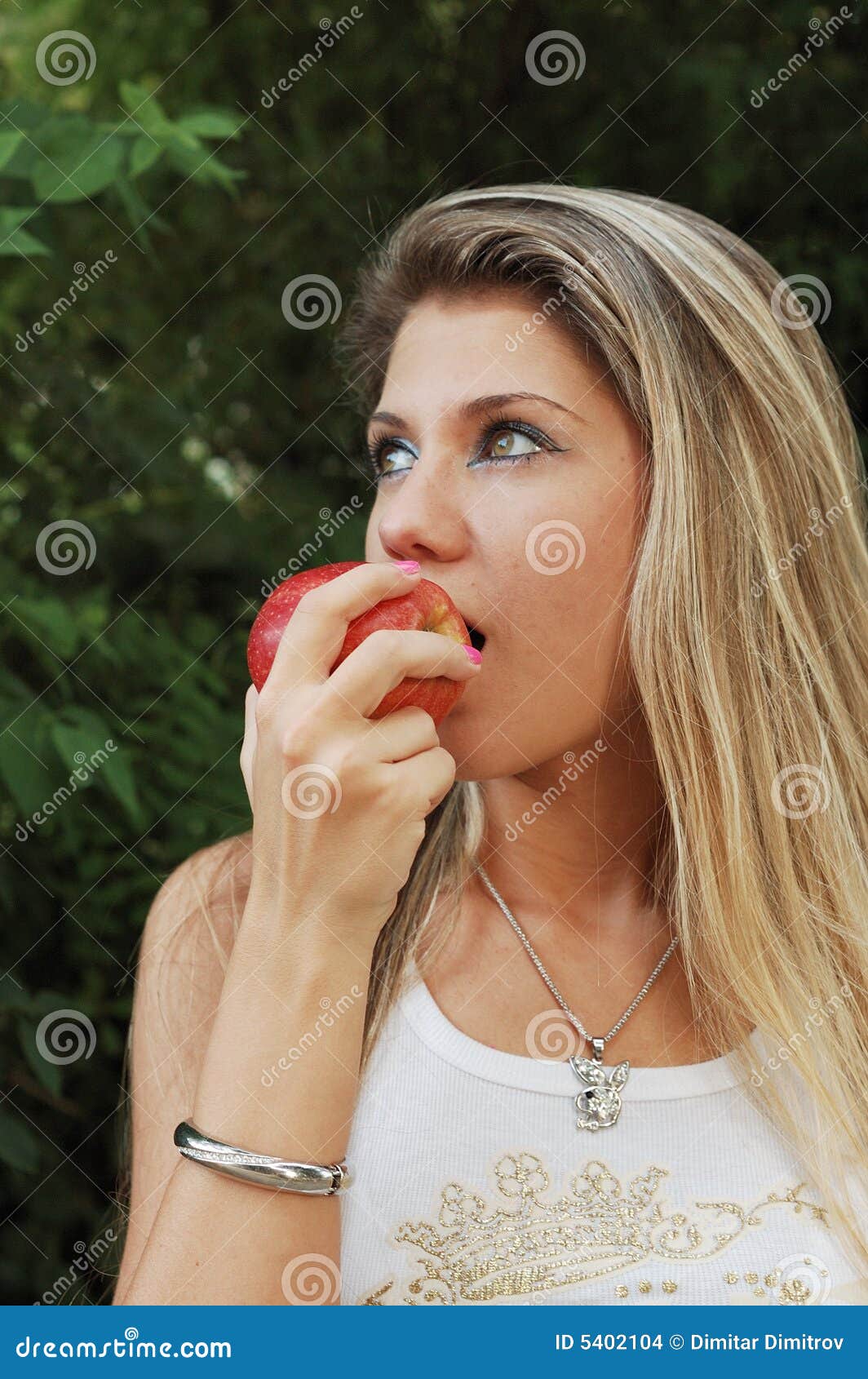 Woman eating red apple stock photo. Image of temptation - 5402104