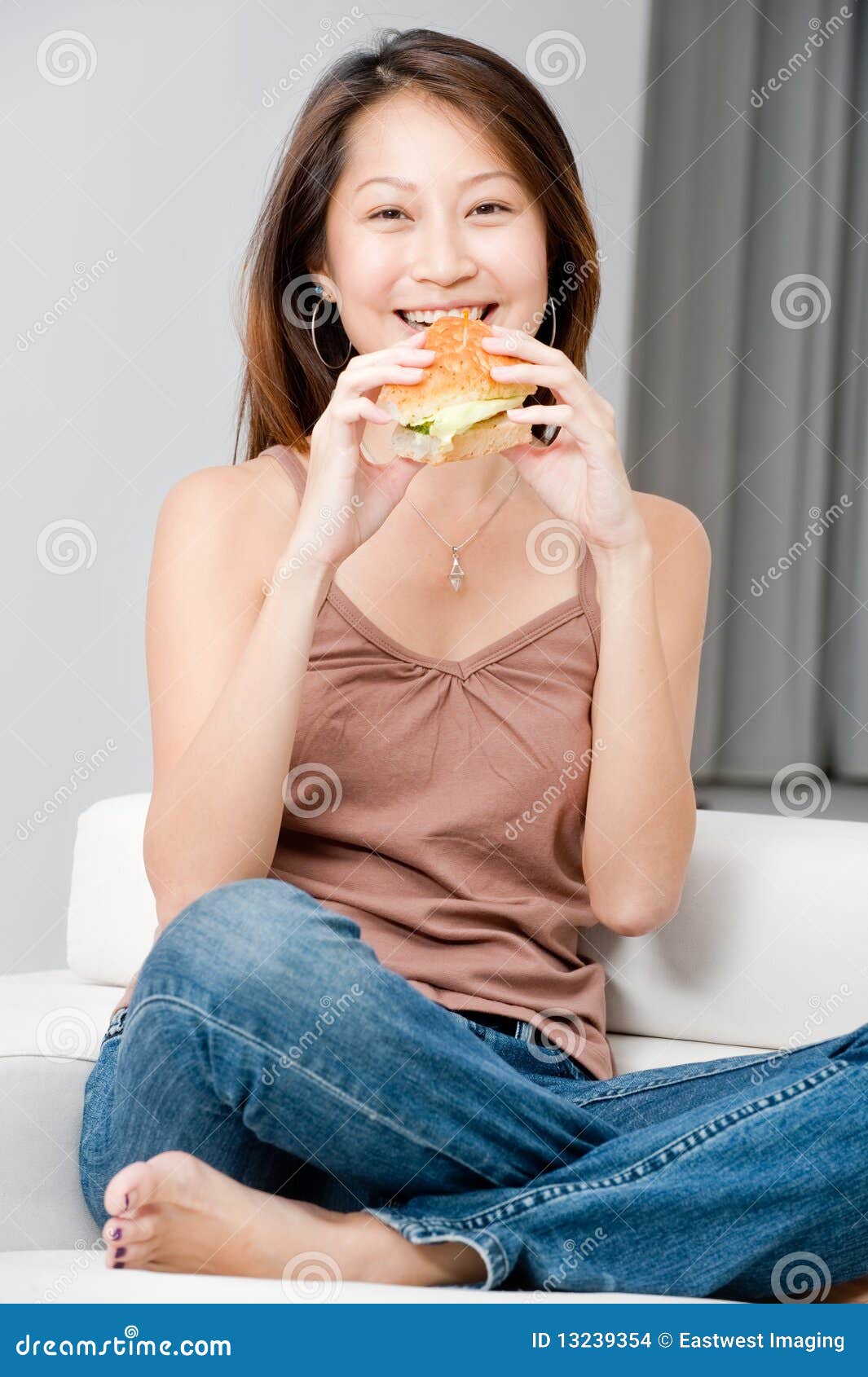 Woman Eating Sandwich stock photo. Image of lifestyle - 13239354
