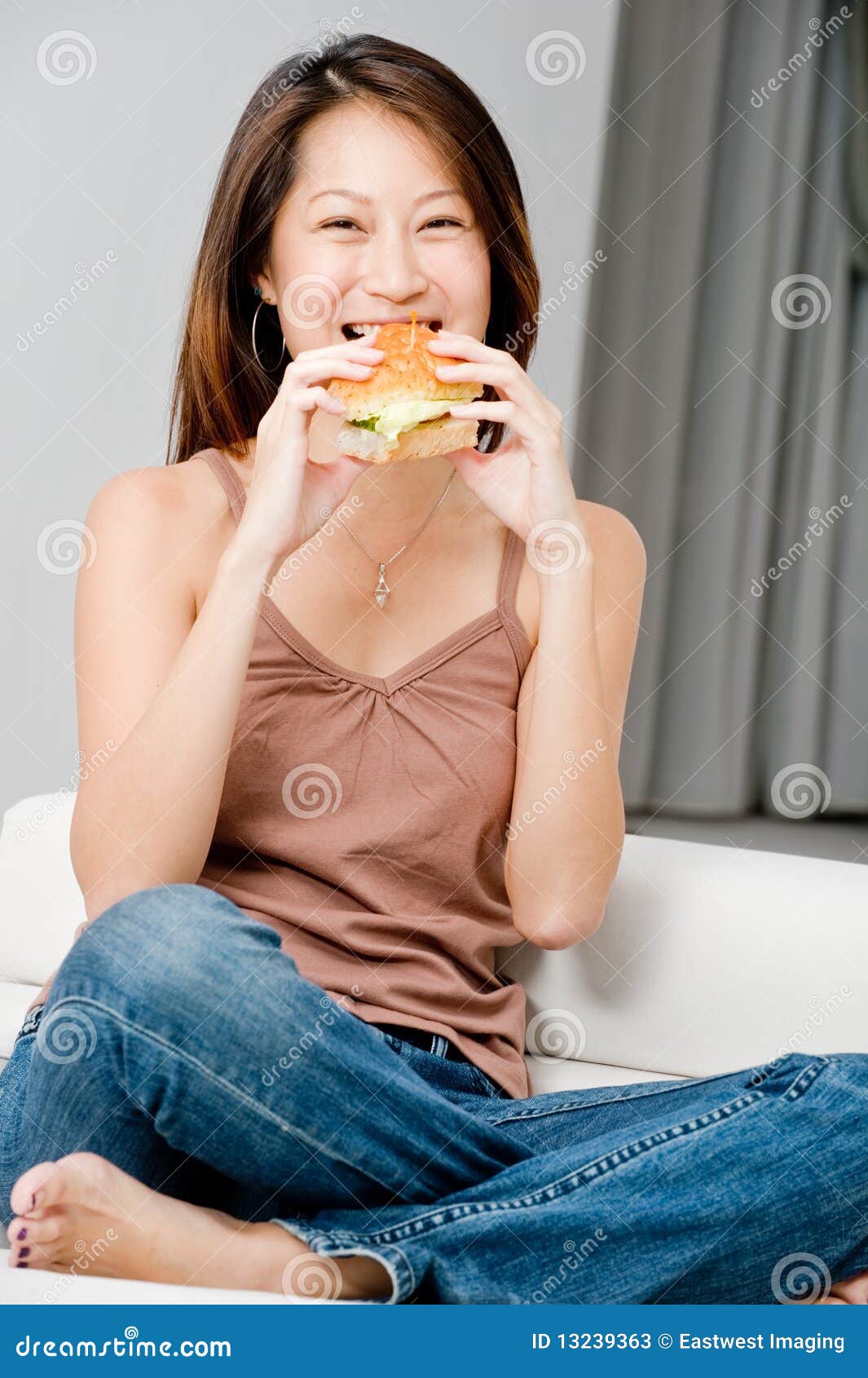 Woman Eating Sandwich stock image. Image of young, food - 13239363