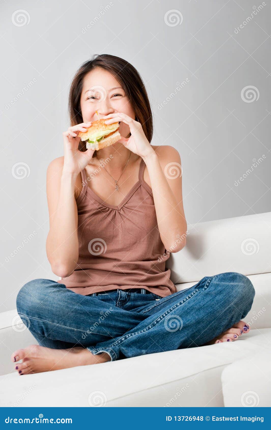 Woman Eating Sandwich stock photo. Image of slim, individual - 13726948