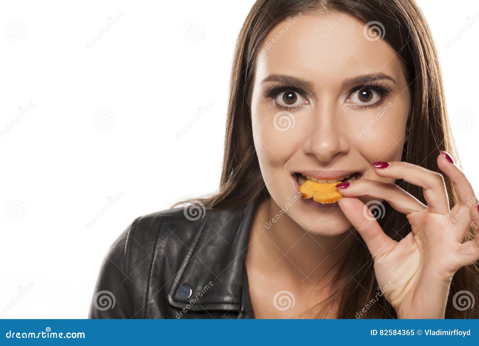 Woman eating snacks stock image. Image of beautiful, snack - 82584365