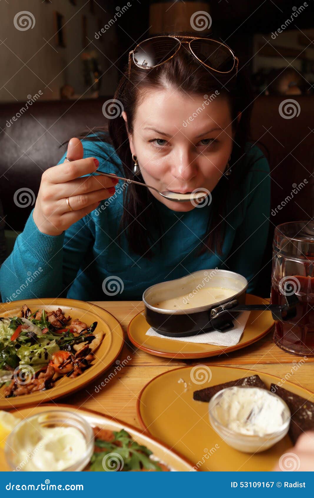 Woman eating soup stock image. Image of diner, fish, bowl - 53109167